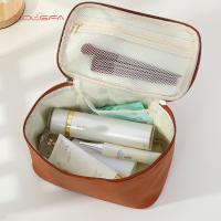 China PU Soft Leather New Arrival Travel Portable Makeup Bags Storage Large Capacity Waterproof Stylish Bow Handle Cosmetic Bag for sale