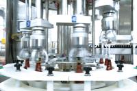 China Multi Heads Rotary Semi Automatic Bottle Capper for sale