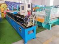 China Heavy Duty Stable Performance Roller Shutter Door Roll Forming Machine 6m/Min for sale