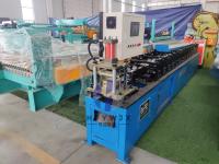 China High Speed Galvanized Steel Roller Door Roll Forming Machine PLC Control System And 16mm Wall Plate for sale