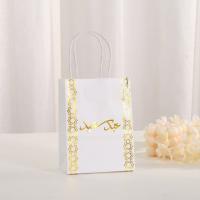 China Arabic Printed Packaging Kraft Paper Bag for Hot Stamping Festival Celebration Gift for sale