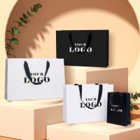 China Cardboard Stamping Printed White Gift Paper Shopping Bags With Logos For Promotion for sale