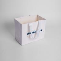 China Luxury Black Paper Bag With Ribbon Handles for Custom Printed Logo Jewelry Packaging for sale