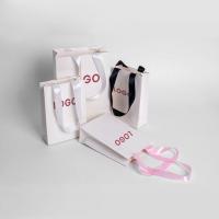 China Luxury Black Paper Bag With Ribbon Handles for Custom Printed Logo Jewelry Packaging for sale