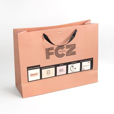 China Large Winter Sweater Packaging Customize Reusable Shopping Bag with Ivory Board Paper for sale