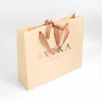 China Hand Length Handle Customized Logo Clothing Garment Peach Paper Bag with Ribbon for sale