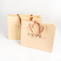 China Hand Length Handle Customized Logo Clothing Garment Peach Paper Bag with Ribbon for sale