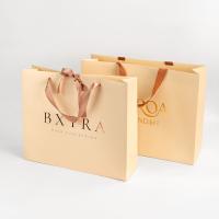 China Hand Length Handle Customized Logo Clothing Garment Peach Paper Bag with Ribbon for sale