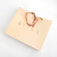 China Hand Length Handle Customized Logo Clothing Garment Peach Paper Bag with Ribbon for sale