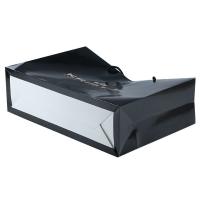 China Upgrade Your Packaging with Our Luxury Matte Black Paper Bag Industrial Gift Craft for sale