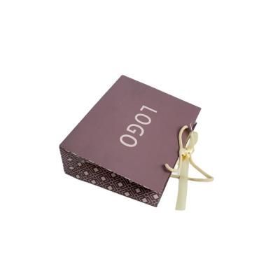 China Deluxe Clothes Packaging Gift Bag With Handmade Ribbon Handle and Partone Color CMYK for sale