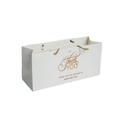 China Apparel Packaging Paper Bag with Customer's Logo and CMYK 4 Color Offset Printing for sale