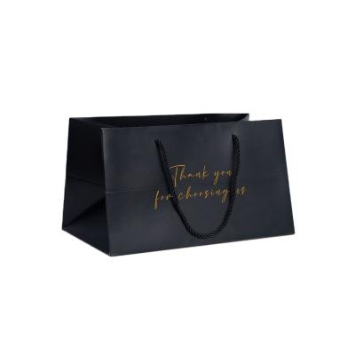 China Custom Printed Logo Luxury Gift Paper Bag with Your Own Logo Retail Boutique Shopping Bags for sale