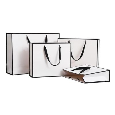 China Gift Craft Industrial Customized Kraft Paper Shopping Bag with Ribbon Handle for sale