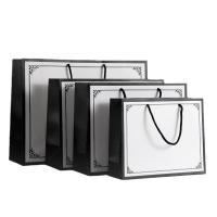 China Gift Craft Industrial Customized Kraft Paper Shopping Bag with Ribbon Handle for sale