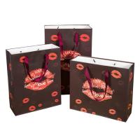 China Customized Luxury Fancy Craft Gift Paper Bag with Logo Print and Gravure Printing Surface for sale