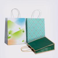 China Custom Logo White Kraft Paper Shopping Bag With Ribbon Handle for Bio-degradable Packaging for sale