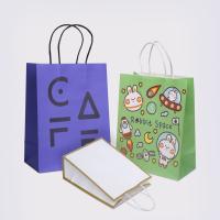 China Custom Logo White Kraft Paper Shopping Bag With Ribbon Handle for Bio-degradable Packaging for sale
