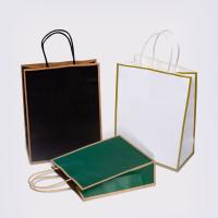 China Custom Logo White Kraft Paper Shopping Bag With Ribbon Handle for Bio-degradable Packaging for sale