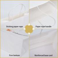 China Custom Logo White Kraft Paper Shopping Bag With Ribbon Handle for Bio-degradable Packaging for sale