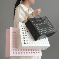 China Business Shopping Gravure Printing High End Fashion Luxury Heavy Hollow Out Paper Bags for sale