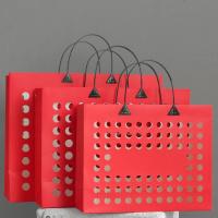 China Business Shopping Gravure Printing High End Fashion Luxury Heavy Hollow Out Paper Bags for sale