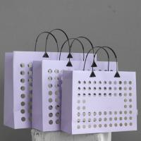 China Business Shopping Gravure Printing High End Fashion Luxury Heavy Hollow Out Paper Bags for sale