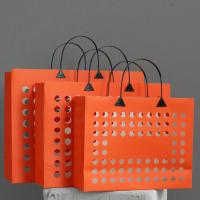 China Business Shopping Gravure Printing High End Fashion Luxury Heavy Hollow Out Paper Bags for sale