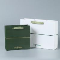 China Customized Logo Accepted Ivory Board Paper Bags for Boutique Requirement for sale