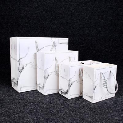 China Customized Logo Retail Gift Shopping Boutique Paper Bag With Logo For Your Requirements for sale
