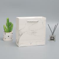 China Custom Reasonable Boutique Retail Paper Gift Shopping Rope Handle Bag Custom Order for sale
