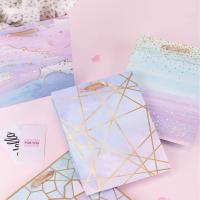 China Designer Folding Glossy Shopping Paper Bag With Ribbon Handle and Gravure Printing for sale