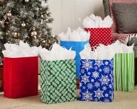 China Customized Logo Merry Christmas Shopping Gift Packaging Twist Handle Kraft Paper Bag for sale