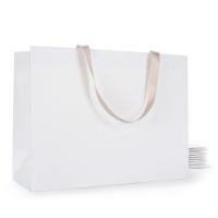 China Large White Card Hot Stamping Custom Logo Printing Paper Bag for Clothes and Boutiques for sale