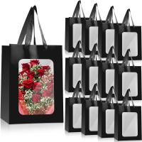 China Custom Flower Gift Packaging Kraft Paper Bags With Transparent Window and Custom Logo for sale
