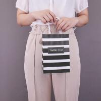 China Custom Private Logo Printed Stripe Kraft Paper Bag for Business Shopping Custom Orders for sale