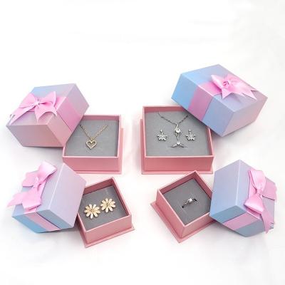 China Color Shape and Logo Custom Gift Jewelry Storage Box with Ribbon Bow Gravnre Printing for sale