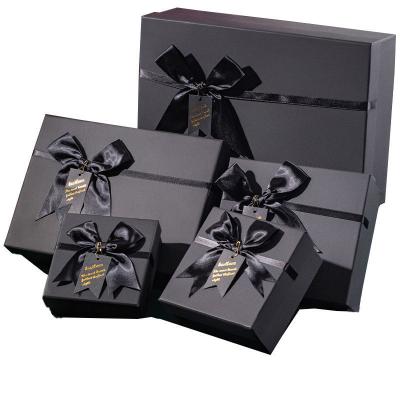 China Custom Cosmetic Perfume Bottle Gift Box With Black Bow Ribbon Lid And Base Packaging for sale