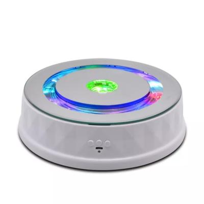 China Multifunction Automatic Rotating Display Stand with Bluetooth Speaker 8kg Load Capacity 23x23cm Platform for sale