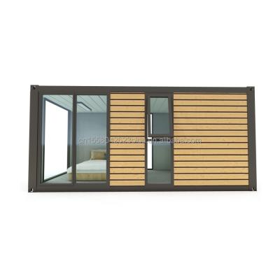 China 20ft Modern Prefabricated Steel Container House Wooden Color Living Prefab Residential Tiny House Couple Hotel Room for sale