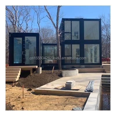 China Hotel Luxury Portable Flat Roof Container Prefab Studio Home House with 50/75/100mm Wave Sandwich Panel Wall and Affordable for sale