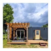 China Hotel Luxury Portable Flat Roof Container Prefab Studio Home House with 50/75/100mm Wave Sandwich Panel Wall and Affordable for sale