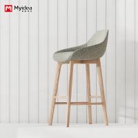 China Commercial-Grade Eco-Friendly Fabric Bar Stool with Natural Wood Base Contemporary Design for Cafs Restaurants Boutique Hotels for sale