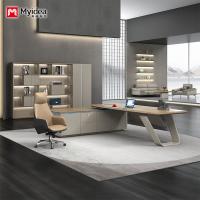 China Premium Managerial Desk with Built-In Power Outlets, Storage Return Cabinet, and Sturdy Steel Legs for sale