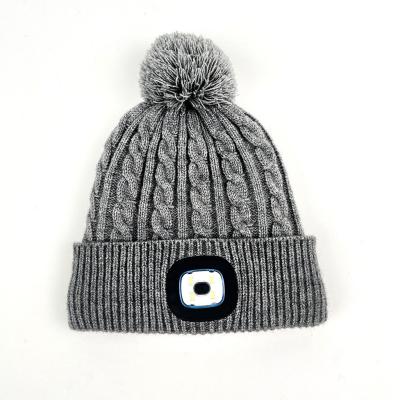 China Rechargeable LED Knitted Pom Pom Beanie Hat Custom Logo Winter Sports 100% RPET for sale