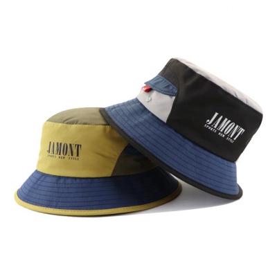 China Unisex Adults Custom Waterproof Printed Bucket Hats With Pocket Polyester for sale