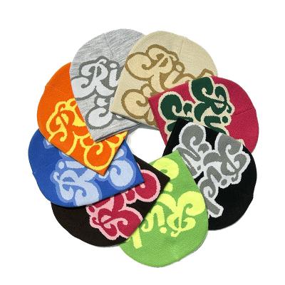 China Custom Hip Hop Letter Jacquard Y2K Beanie 22cm Color Block Skull Cap Unisex Winter Hat for sale