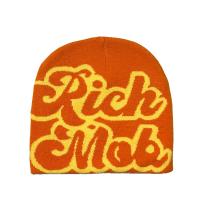 China Custom Hip Hop Letter Jacquard Y2K Beanie 22cm Color Block Skull Cap Unisex Winter Hat for sale