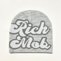 China Custom Hip Hop Letter Jacquard Y2K Beanie 22cm Color Block Skull Cap Unisex Winter Hat for sale
