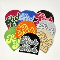China Custom Hip Hop Letter Jacquard Y2K Beanie 22cm Color Block Skull Cap Unisex Winter Hat for sale